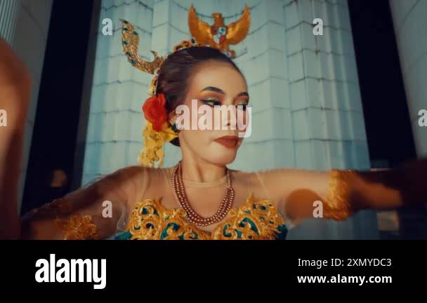 A traditional dance performance featuring five dancers in vibrant ...