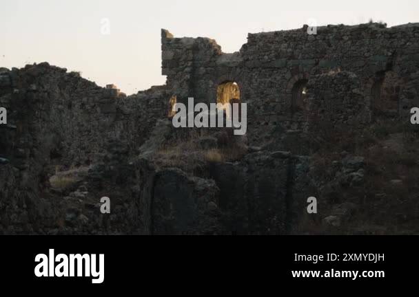 Golden Light Filters Through Ancient Stone Ruins, Illuminating the ...