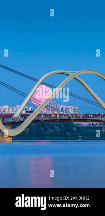 Pink Thunderstorm Full Moon rises on the background of pedestrian ...
