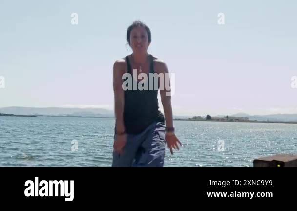 A Latina hip-hop dancer dazzles with her energetic choreography near a ...