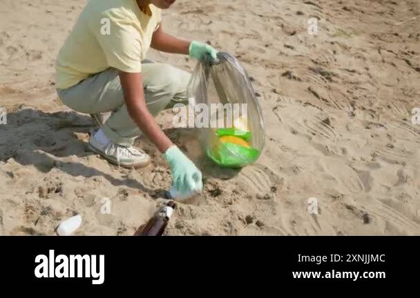 Medium full tilt shot of young Hispanic female environmental activist ...