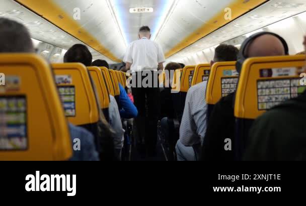 Stewardess or flight attendant on aircraft offering passengers Stock ...