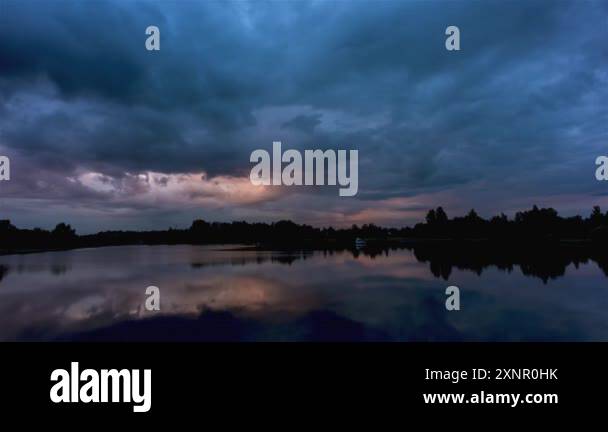 The transformation of the sky as clouds swirl and change colors over a ...