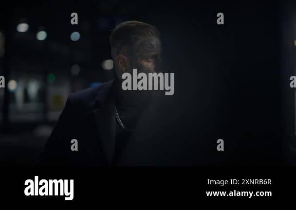 An atmospheric urban scene at night with faint lights and a mysterious ...