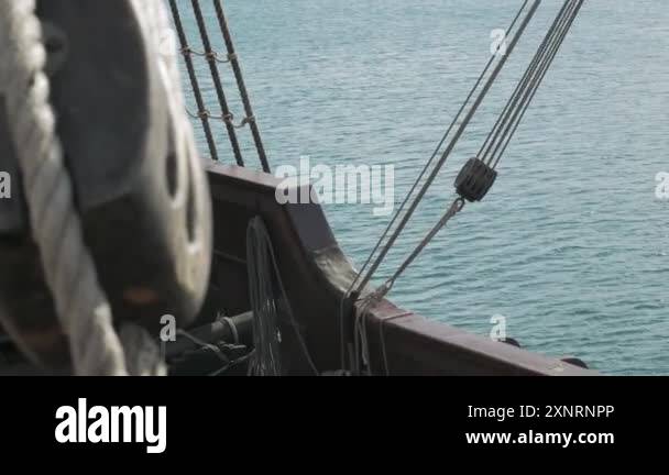 18th century wooden sailing ship deck shot and balustrade overlooking ...