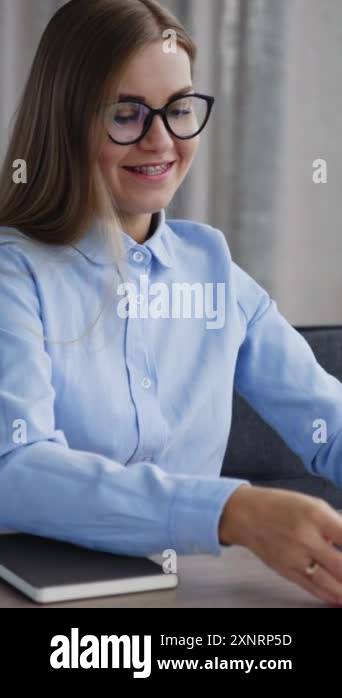 Smiling happy young blonde woman starting working day in office. Lady ...