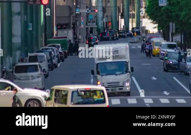 A timelapse of traffic jam at the urban city street in Tokyo. High ...