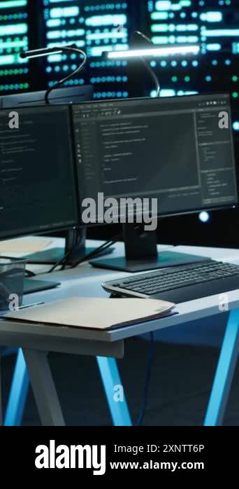 Vertical video Person with disability in inclusive high tech server room facility ensuring data ...