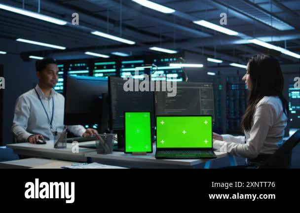 Engineers In Data Center Monitoring Security Threats Using Chroma Key Devices Experts Using
