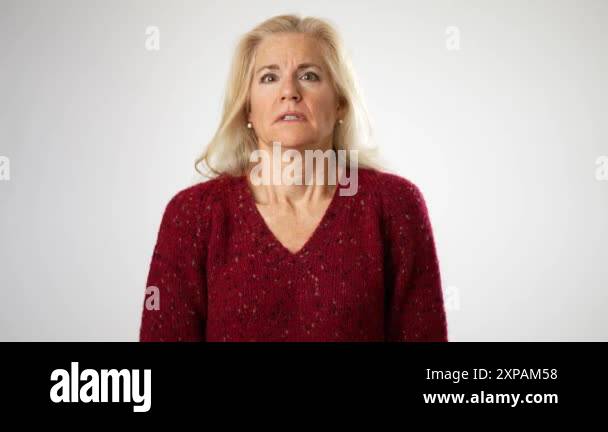 Angry furious mature woman raising hands roar wildly, full of anger ...
