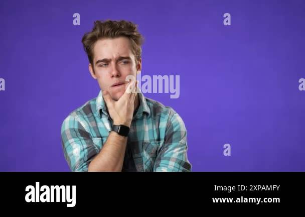 Portrait of thinking, smart puzzled pensive young hipster man 20s looks ...