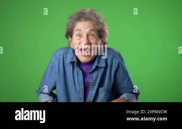 Portrait of happy elderly senior old woman with wrinkled skin and grey ...