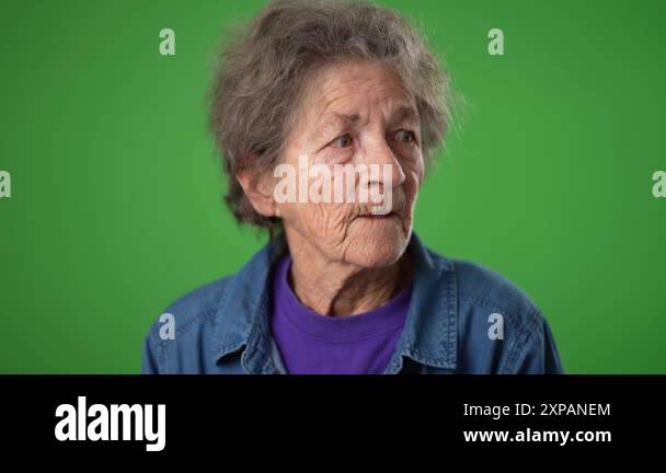 Closeup slow motion portrait of toothless elderly senior old woman with ...