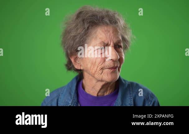 Slow motion closeup portrait of angry upset frustrated angry elderly ...