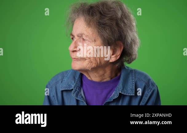 Slow motion closeup portrait of angry upset frustrated angry toothless ...