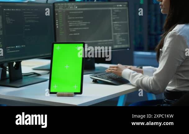 Software Developer In Data Center Monitoring Security Threats Using Mockup Tablet It