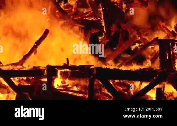 A dramatic image of a fierce fire burning intensely against the dark ...