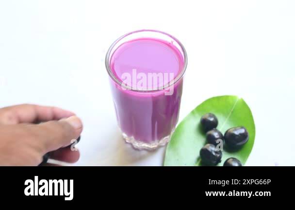 Syzygium cumini fruits juice. Its other names Malabar plum, Java plum, black plum, jamun and ...