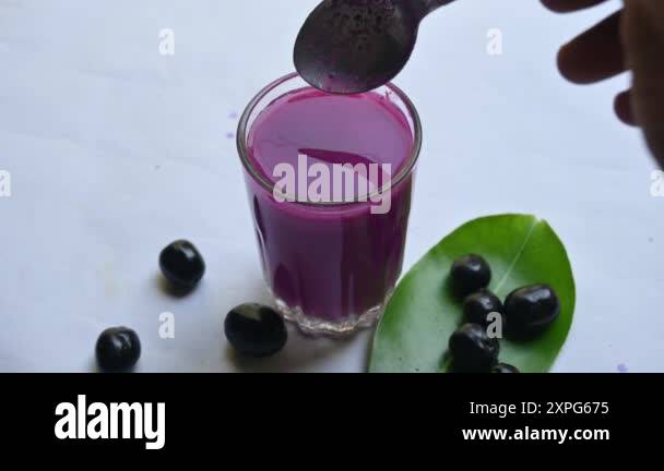Syzygium cumini fruits juice. Its other names Malabar plum, Java plum, black plum, jamun and ...