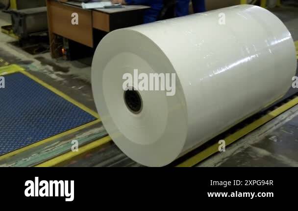 ALMATY, KAZAKHSTAN - JULY 12 2024: Huge paper roll wrapped with foil ...