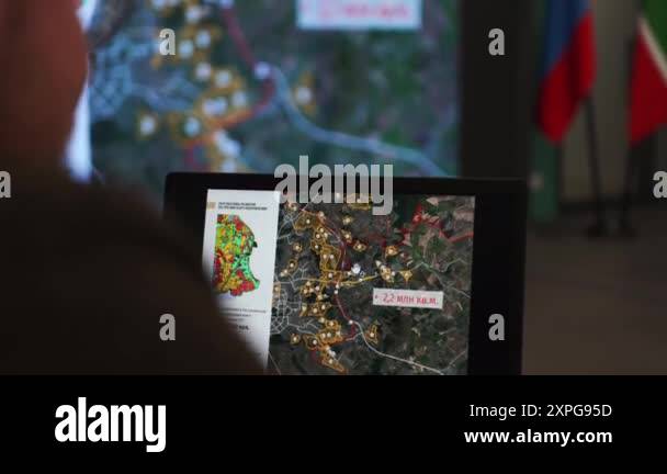 ALMATY, KAZAKHSTAN - JANUARY 22 2024: Presenter shows map of specific ...