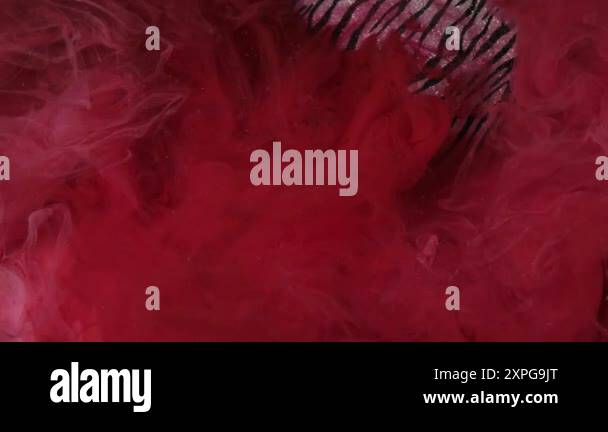 Ink water drop. Vapor cloud. Defocused red color underwater dust ...