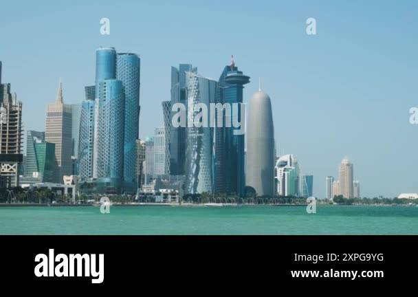 Skyline of Doha city business center with futuristic skyscrapers and a ...