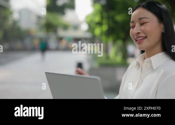 Side View of the Attractive Girl Talking Using the Laptop, Greeting her ...
