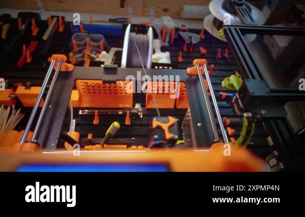 3D printers at work. Creative space home studio. Wall with tools ...