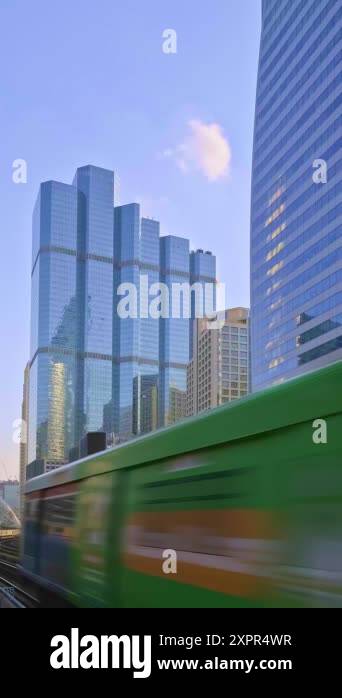 BTS Skytrain, light metro electric train, running fast in downtown ...