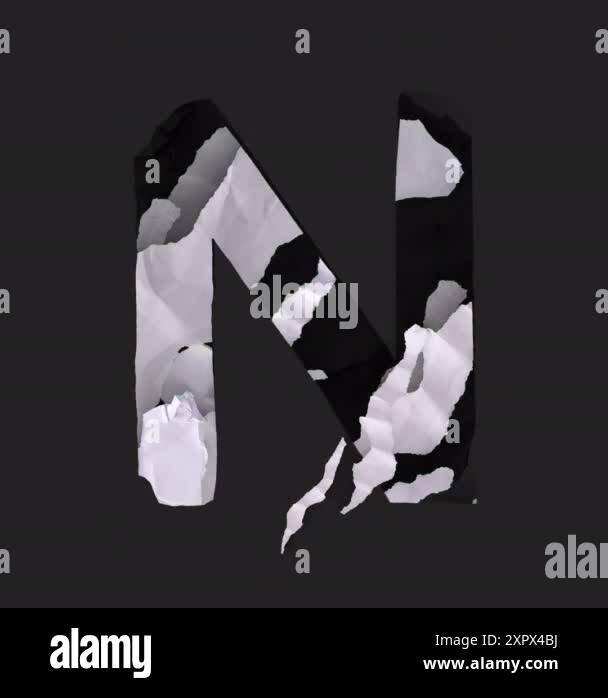A stop frame motion animated style paper shredded letter N Stock Video ...