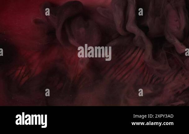 Explosion smog. Paint water splash. Defocused black red color glitter ...