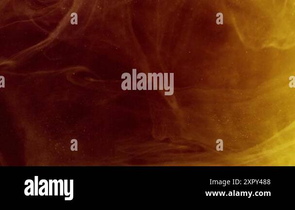 Sparkling smoke. Paint water splash. Defocused yellow bronze golden ...