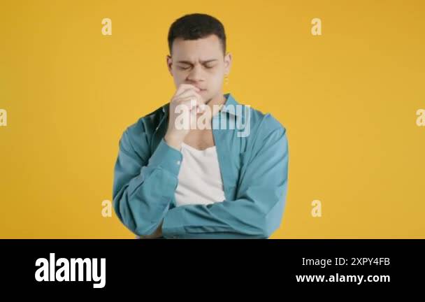 Smart young man having idea eureka moment, pointing finger up on yellow ...