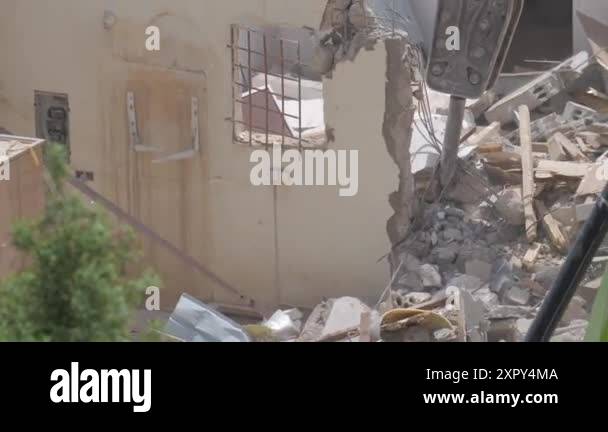 Demolition of residential buildings in Saudi Arabia Excavator loads and ...