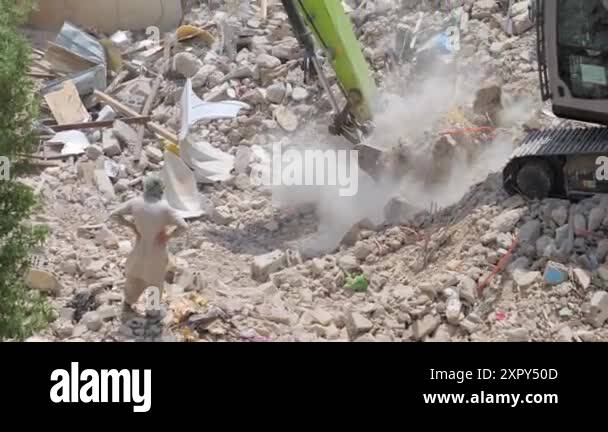 Demolition of residential buildings in Saudi Arabia Excavator loads and ...