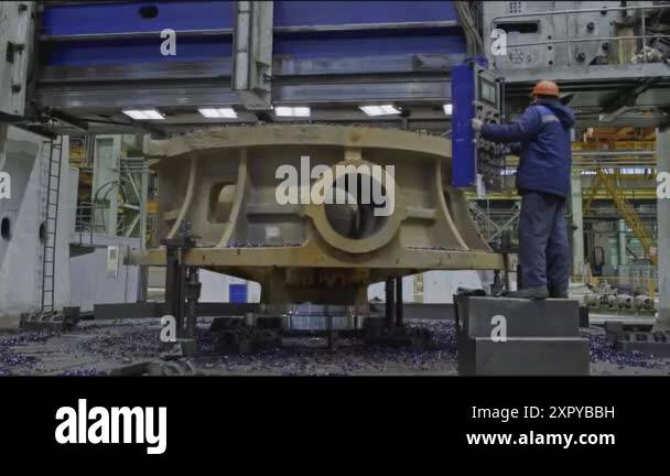 Worker with remote control and rotating lathe. Stock clip. Worker with ...