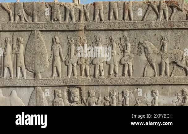 Persepolis, Iran - 1 December 2019: Carvings on a wall at ruins of ...