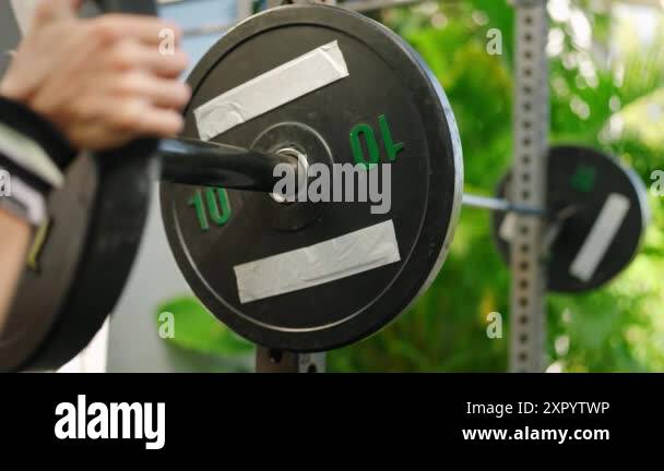 She ensures lift safety, strengthens muscles during day. Fit woman ...