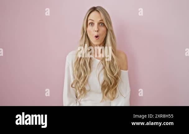 Shocked young woman's face all agog! beautiful blonde, scared and ...