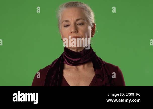 Portrait of sad, unhappy mature woman in her 50s shaking head at camera ...