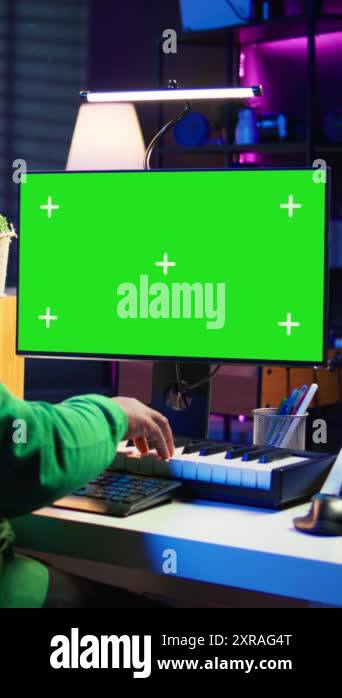 Vertical Video Producer composing music with electronic keyboard notes ...
