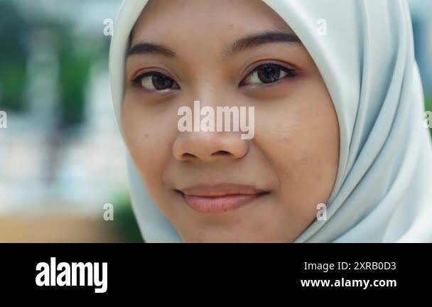 Elegant Woman in Hijab in the Street Making Eye Contact With the Camera. Stunning Young Girl ...