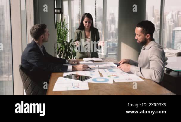 Confident female Mexican boss engages in conversation with multiethnic ...