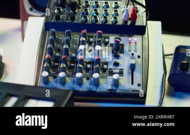 Empty home studio desk with motorized faders and pre amp knobs used ...