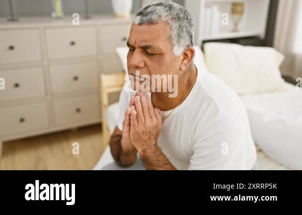 Seated praying Stock Videos & Footage - HD and 4K Video Clips - Alamy