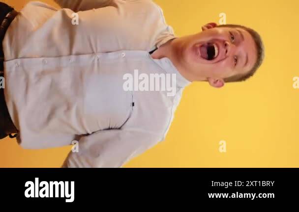 Vertical video. Surprised man. Incredible joy. Achieving success ...