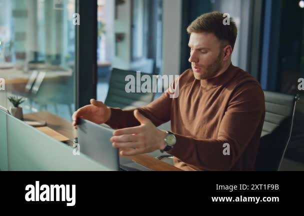 Tired worker closing laptop feeling neck pain at modern workplace ...