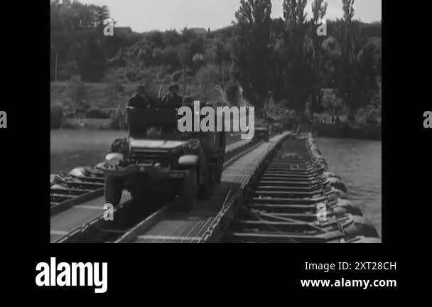 1944 - Tanks of the US Army's 7th Armored Division are driven over a ...