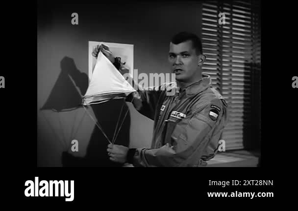A captain in the U.S. Army Parachute Team shows a model of a Leonardo ...